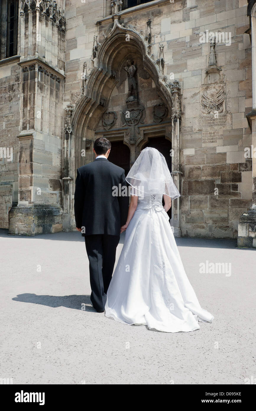 Bride and groom entering the church (concept for marriage made ??by God ...