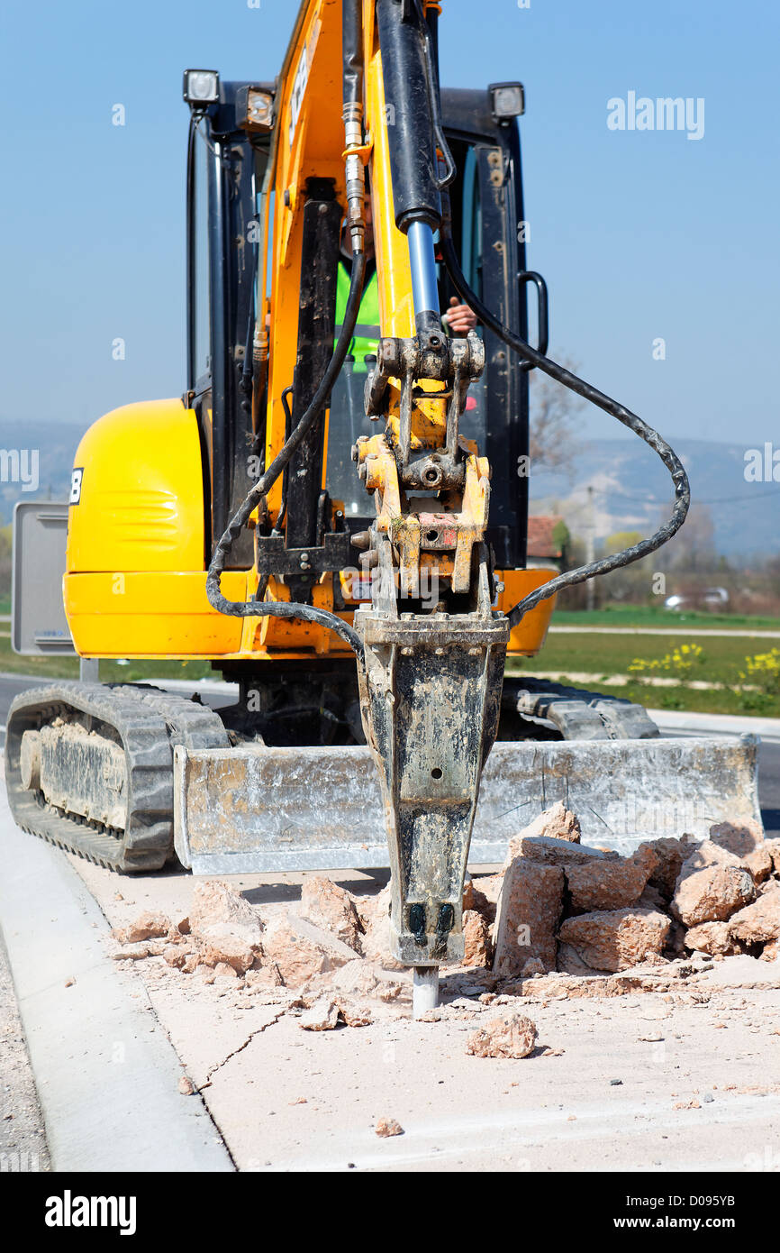 Large jackhammer construction machinery smashing hi-res stock ...