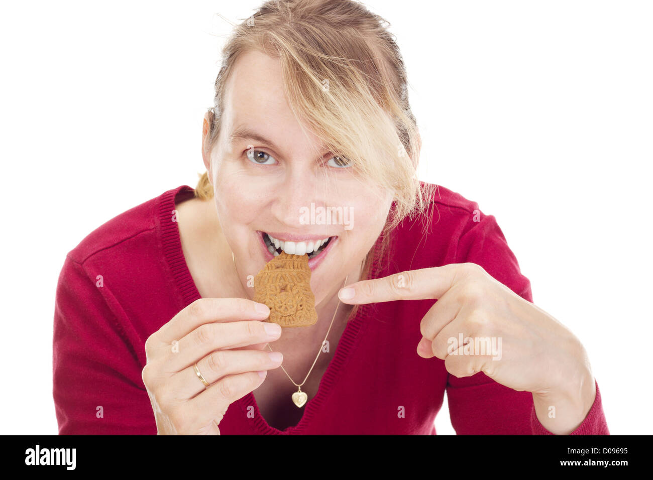 Person eating delicate speculoos Stock Photo - Alamy