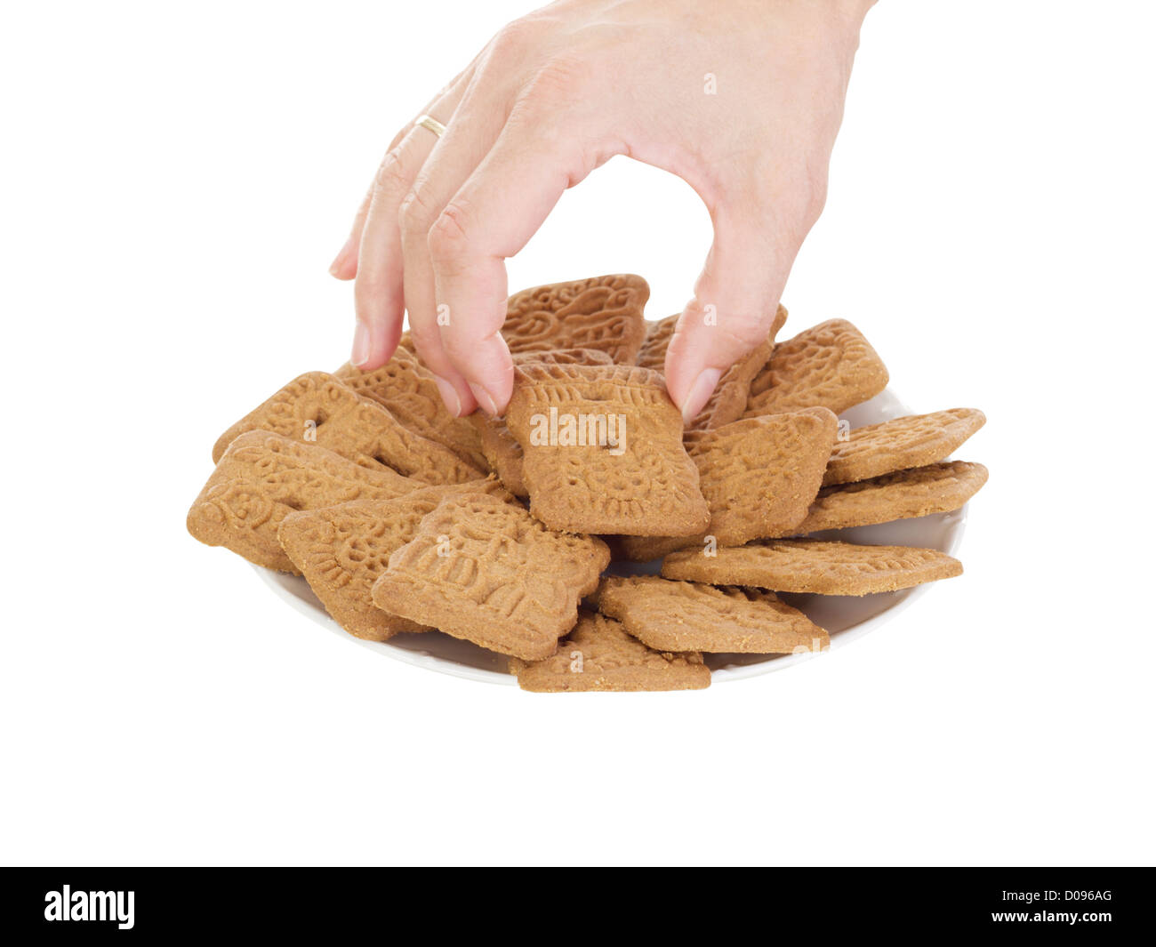 Person eating delicate speculoos Stock Photo - Alamy