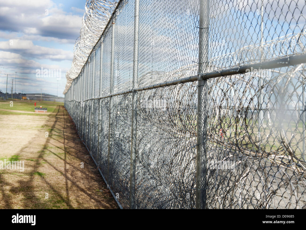 Prison fence and barbed wire at Correctional Facility. High security ...