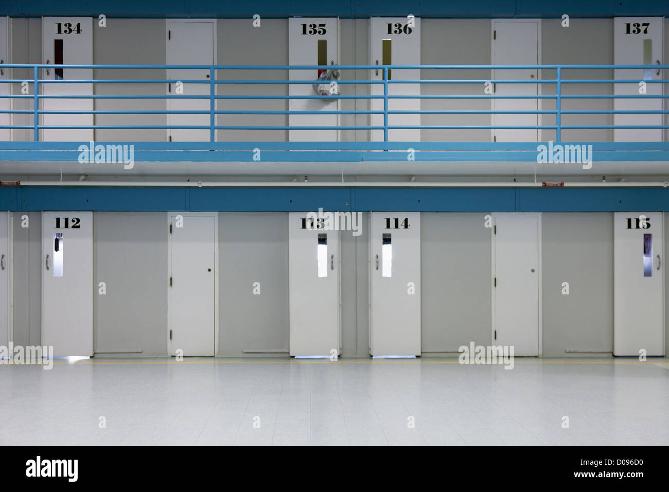 Prison cells on two floors. Doors opening on to a landing. Rooms at a ...