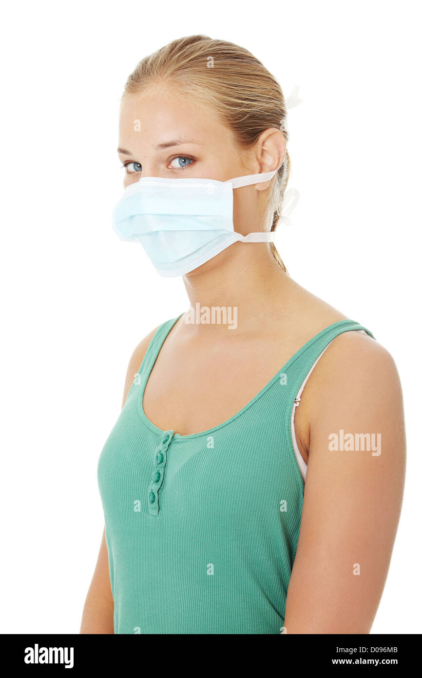 Pretty caucasian woman wearing a face mask to protect from viruses ...
