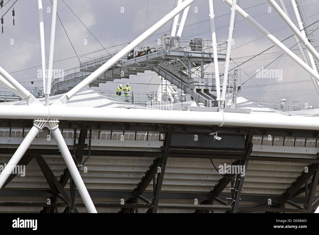 WORKERS WORKING ON ROOF OLYMPIC STADIUM WHICH WILL ACCOMMODATE OLYMPIC ...