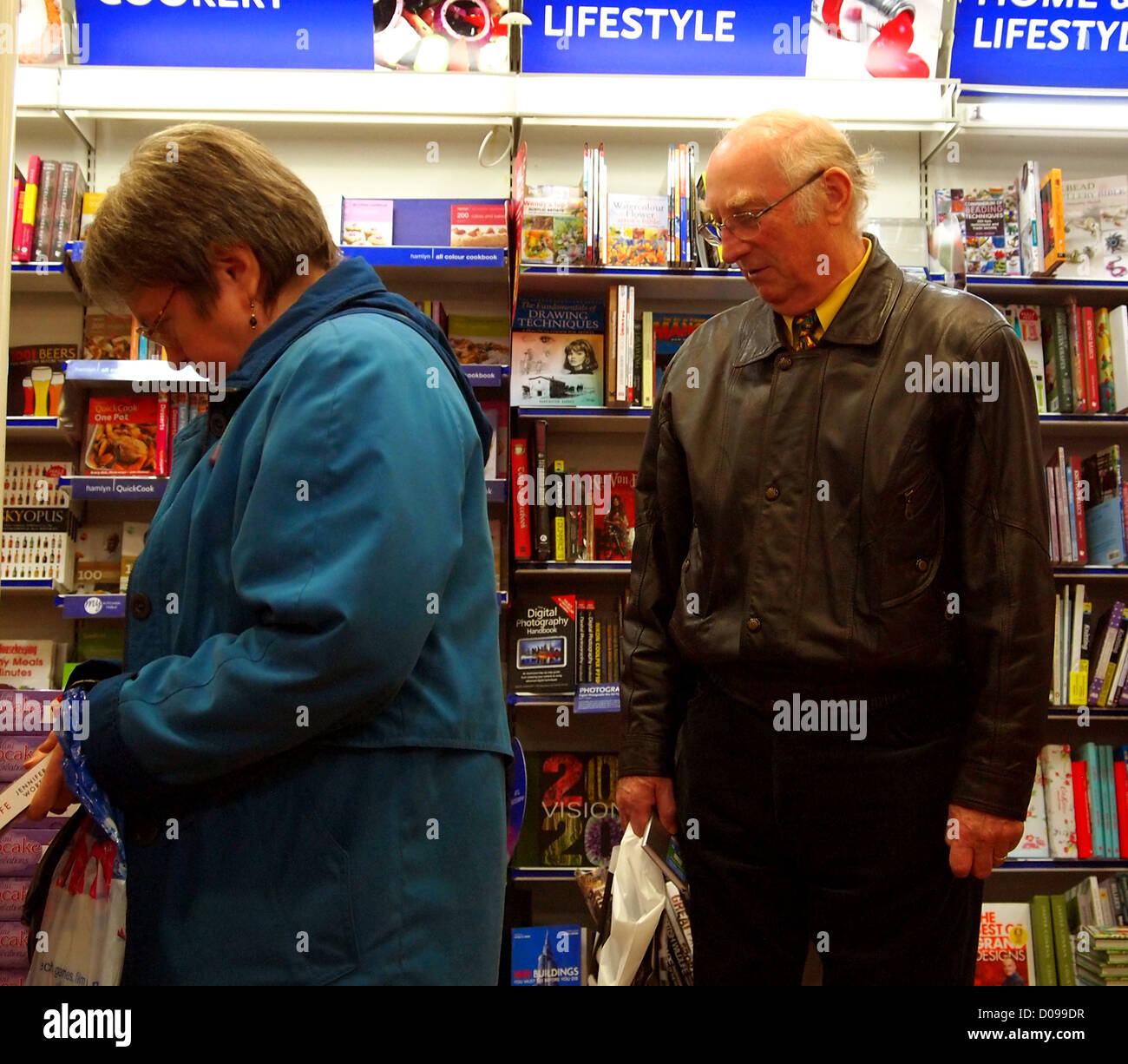 Checking out a book hi-res stock photography and images - Alamy
