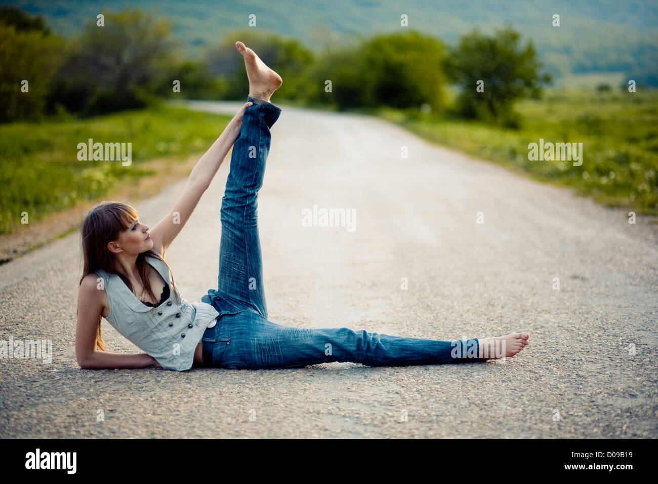 Girl on road Stock Photo - Alamy