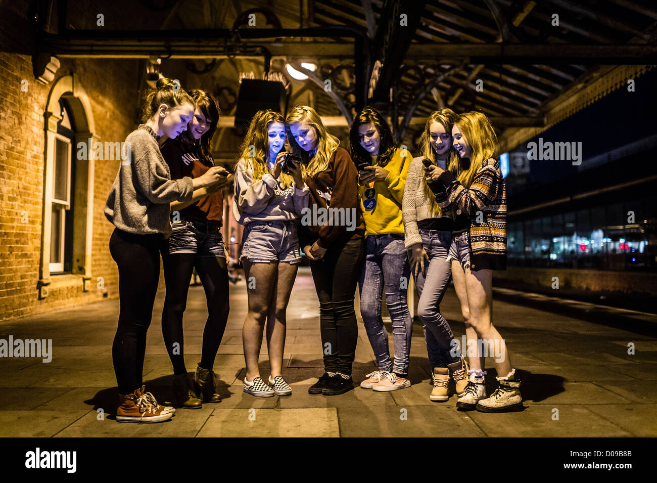A group of seven 14 15 year old teenage girls friends together outside ...
