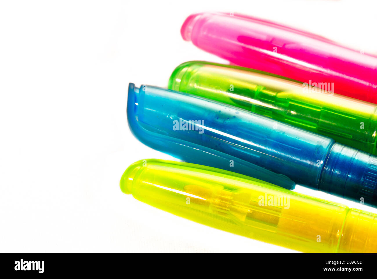 Four coloured pens on white background Stock Photo - Alamy