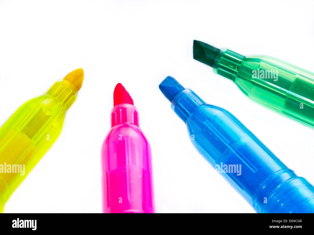 Four coloured pens on white background Stock Photo - Alamy