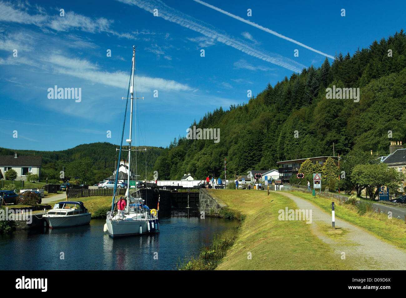 A yacht passing through the locks at Cairnbaan on the Crinan Canal ...