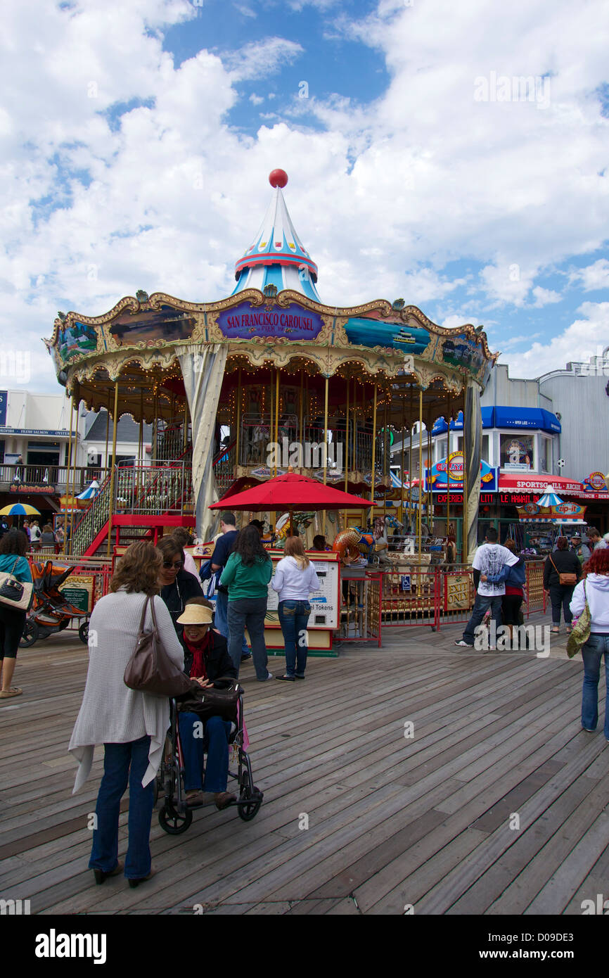 Tourists and San Francisco carousel, Pier 39 Stock Photo - Alamy