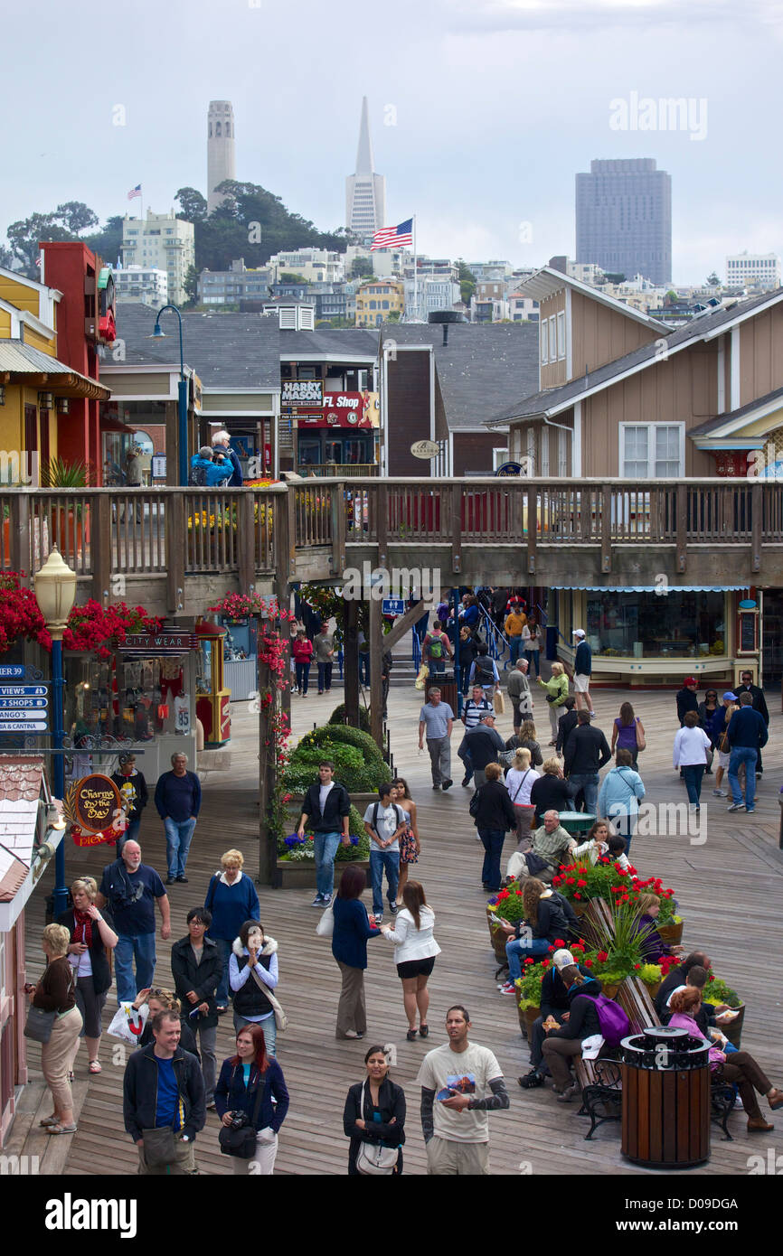 Tourists on Pier 39, Telegraph Hill and Coit Tower in background Stock ...