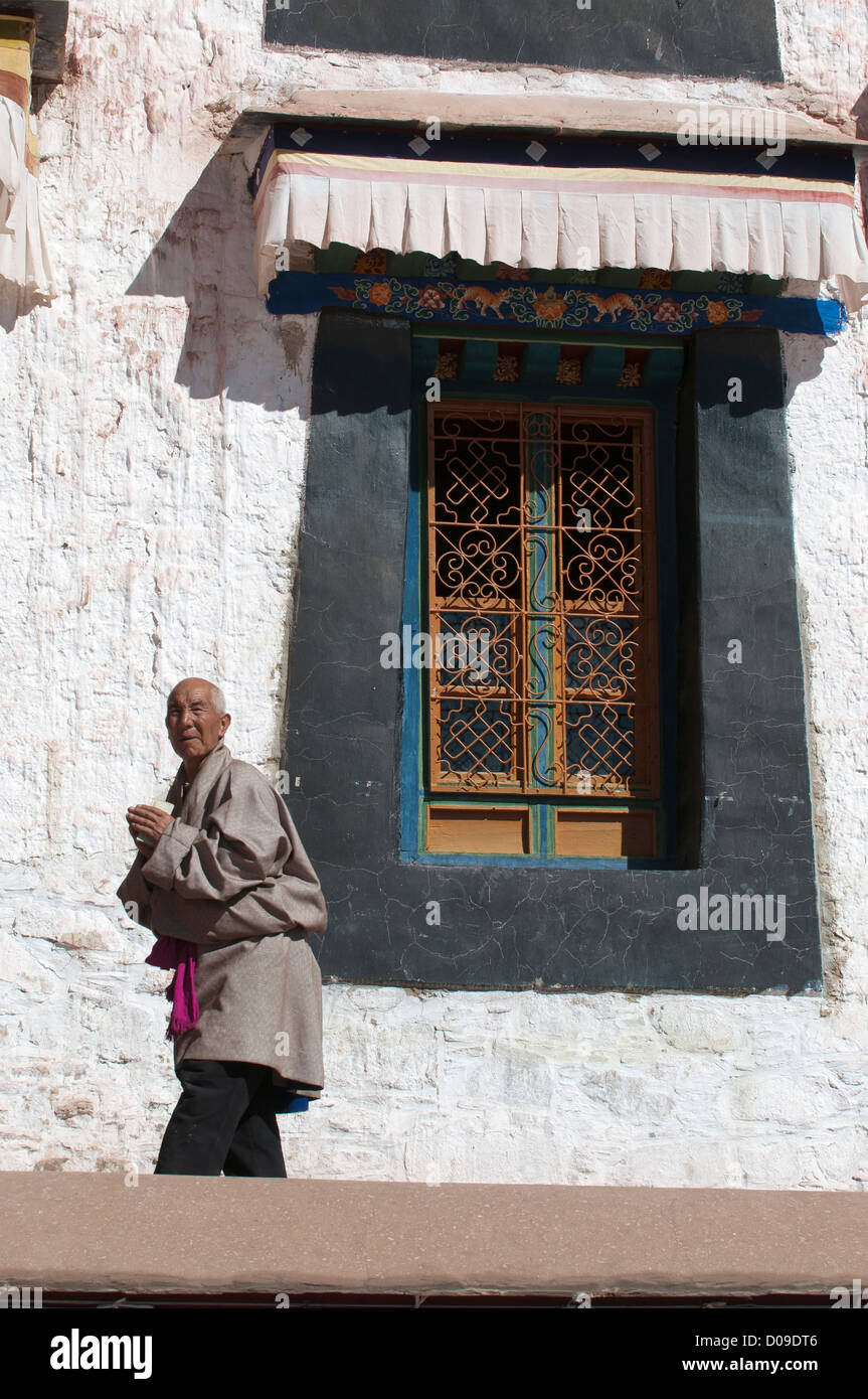 Elderly Buddhist pilgrim visits Drepung Monastery, Lhasa, Tibet, China ...