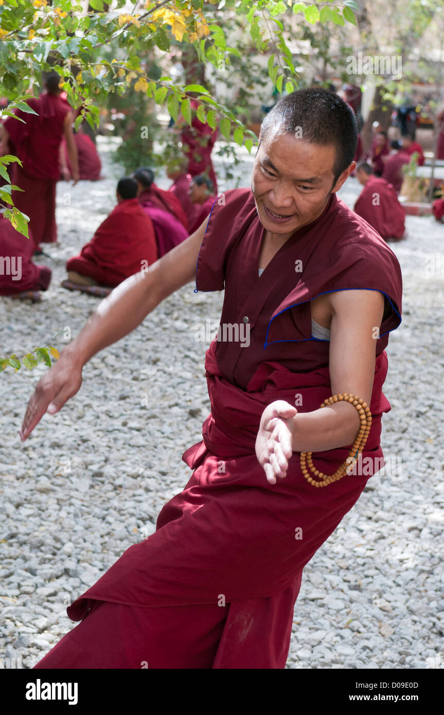 Buddhist monk slaps hands to make point during daily debates, Drepung ...
