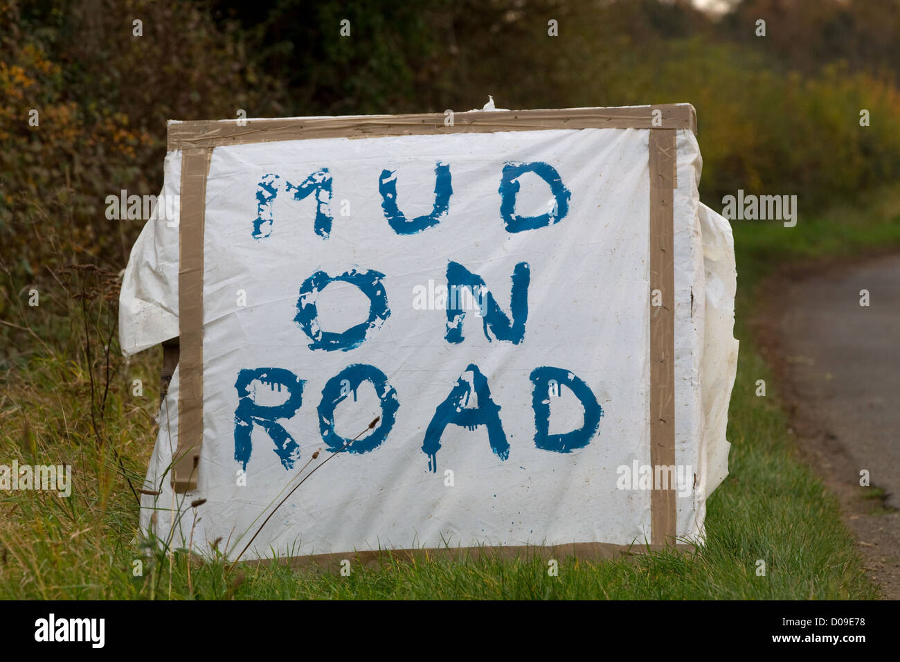 Mud on the road sign Stock Photo - Alamy