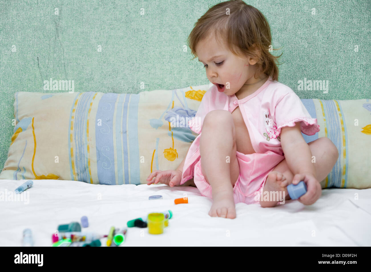Pretty child playing and painting at home Stock Photo - Alamy