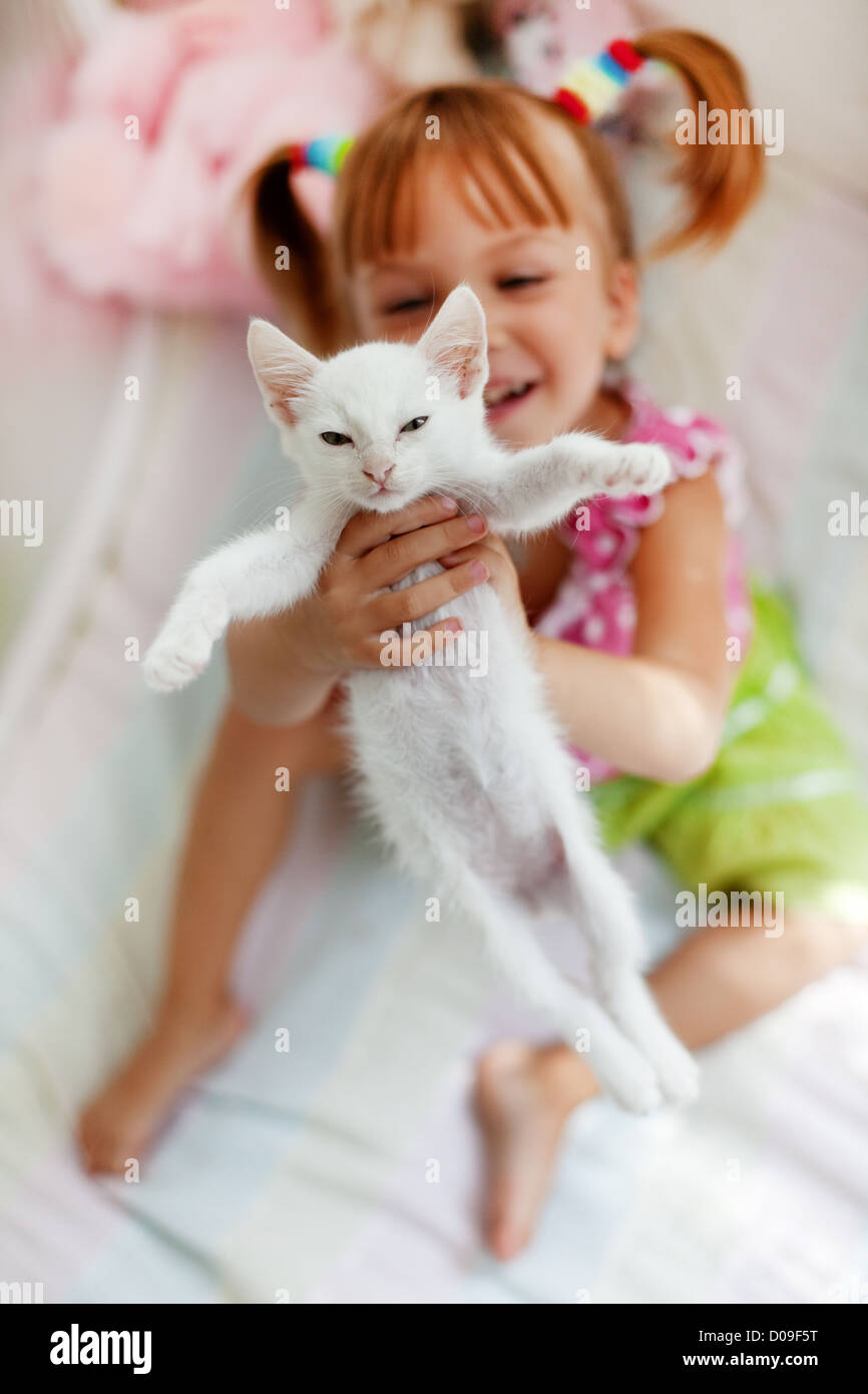 Child with kitty Stock Photo - Alamy