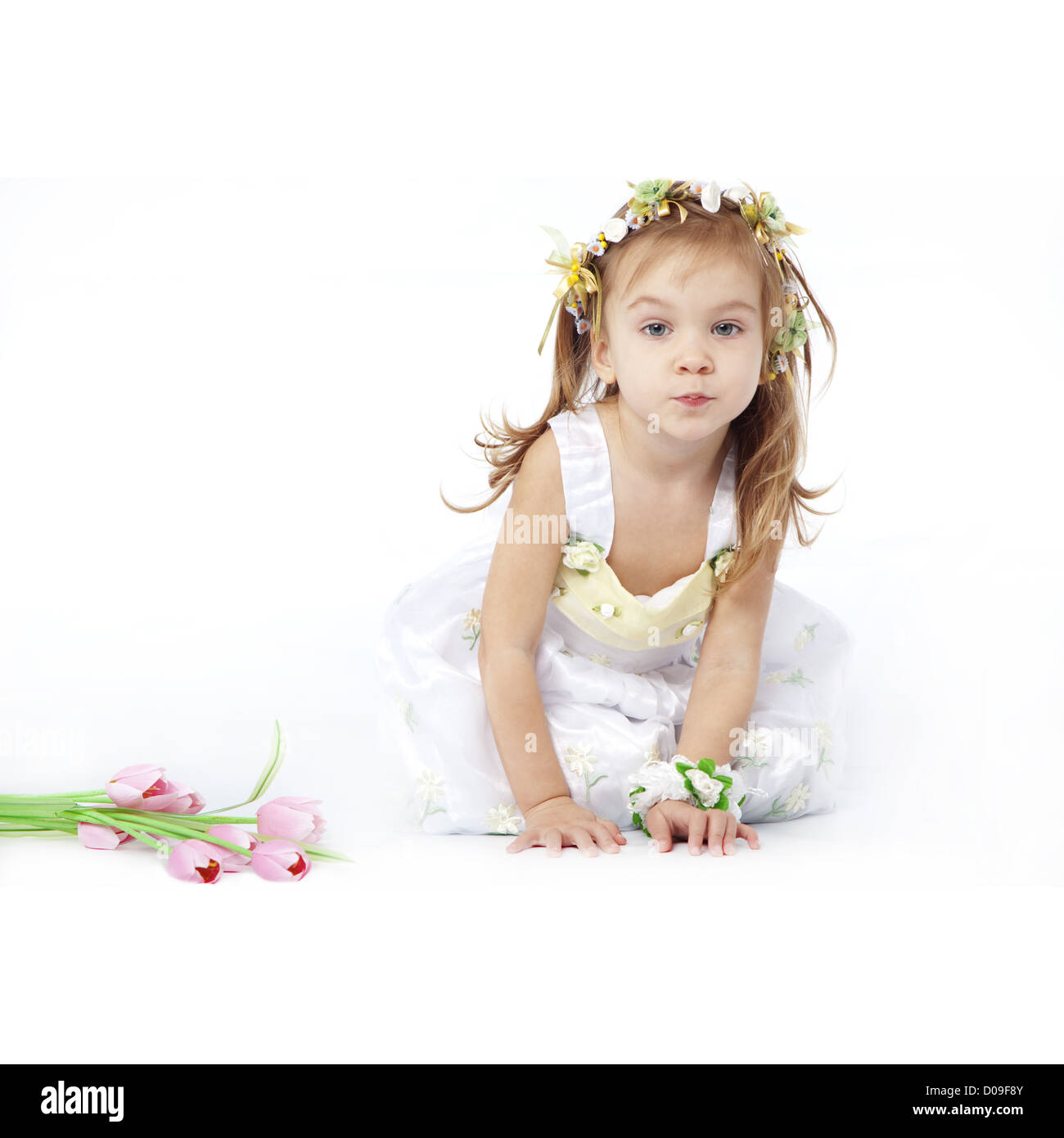 Little girl in spring flower dress isolated on white background with ...