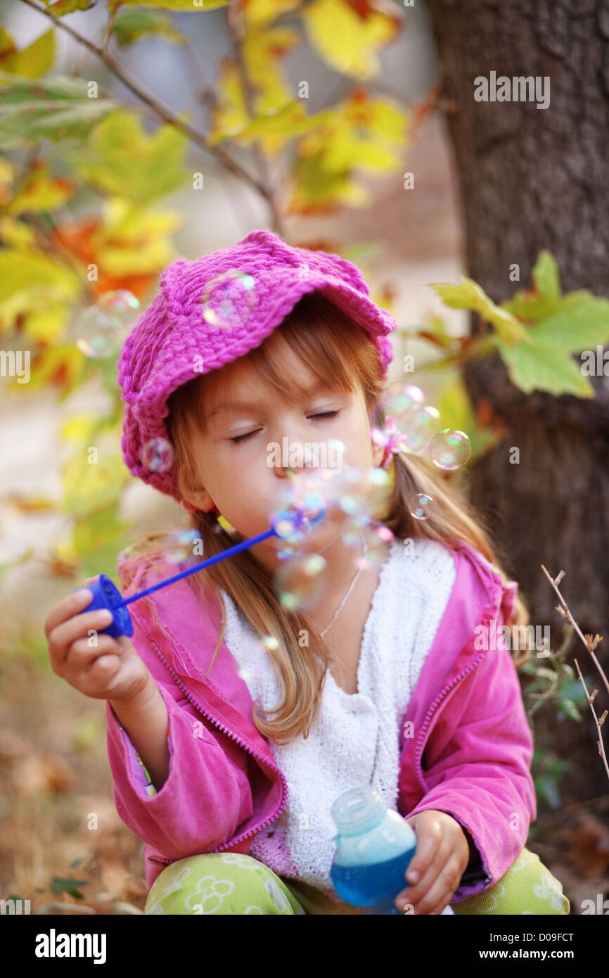 Child blowing bubbles Stock Photo - Alamy