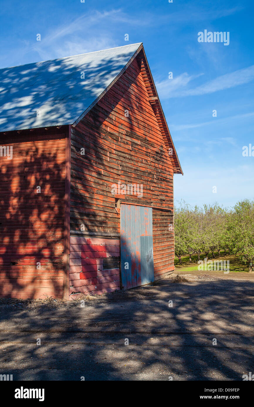 Front entrance of red barn with weathered wooden siding and silver ...