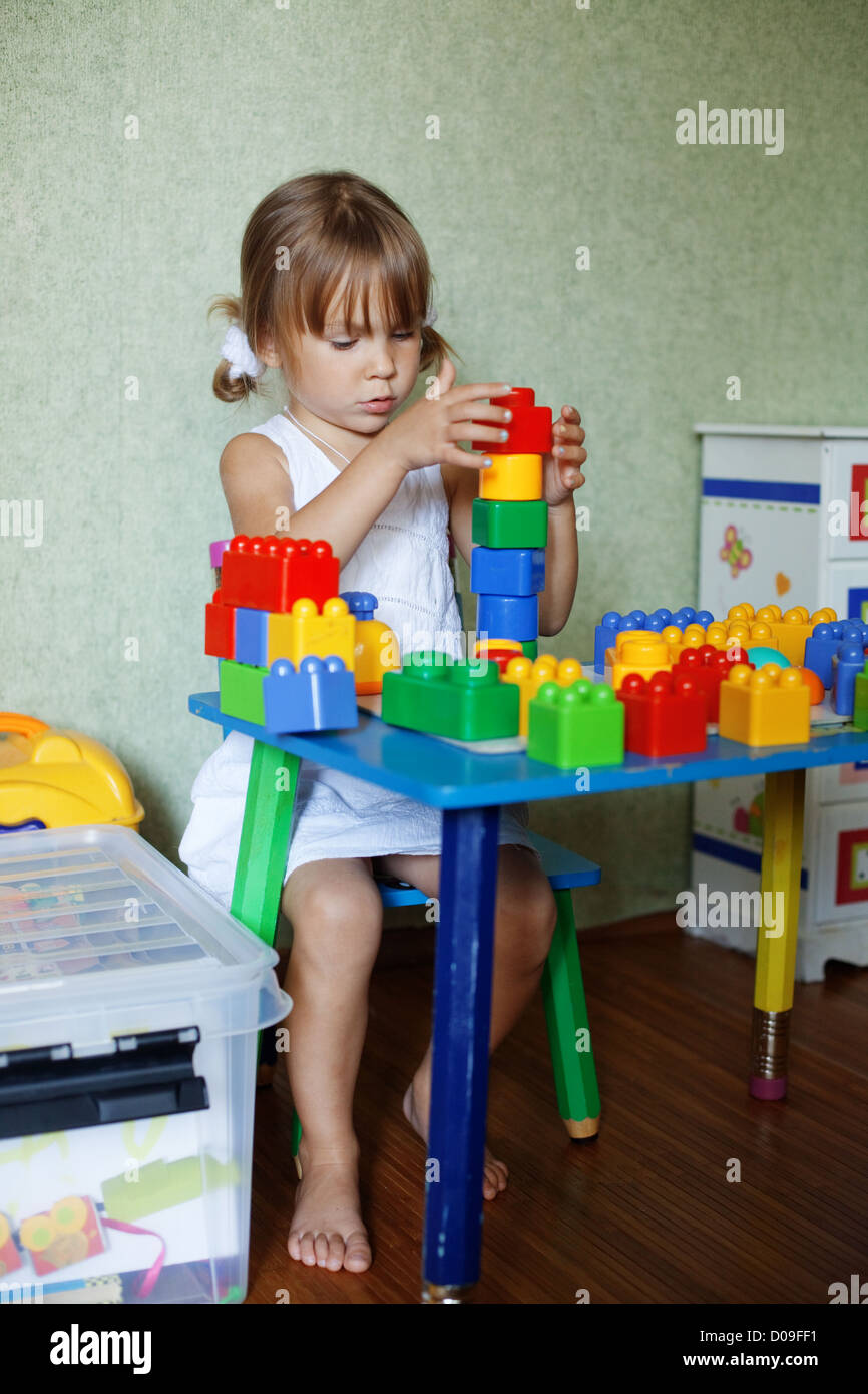 Child playing with constructor Stock Photo - Alamy