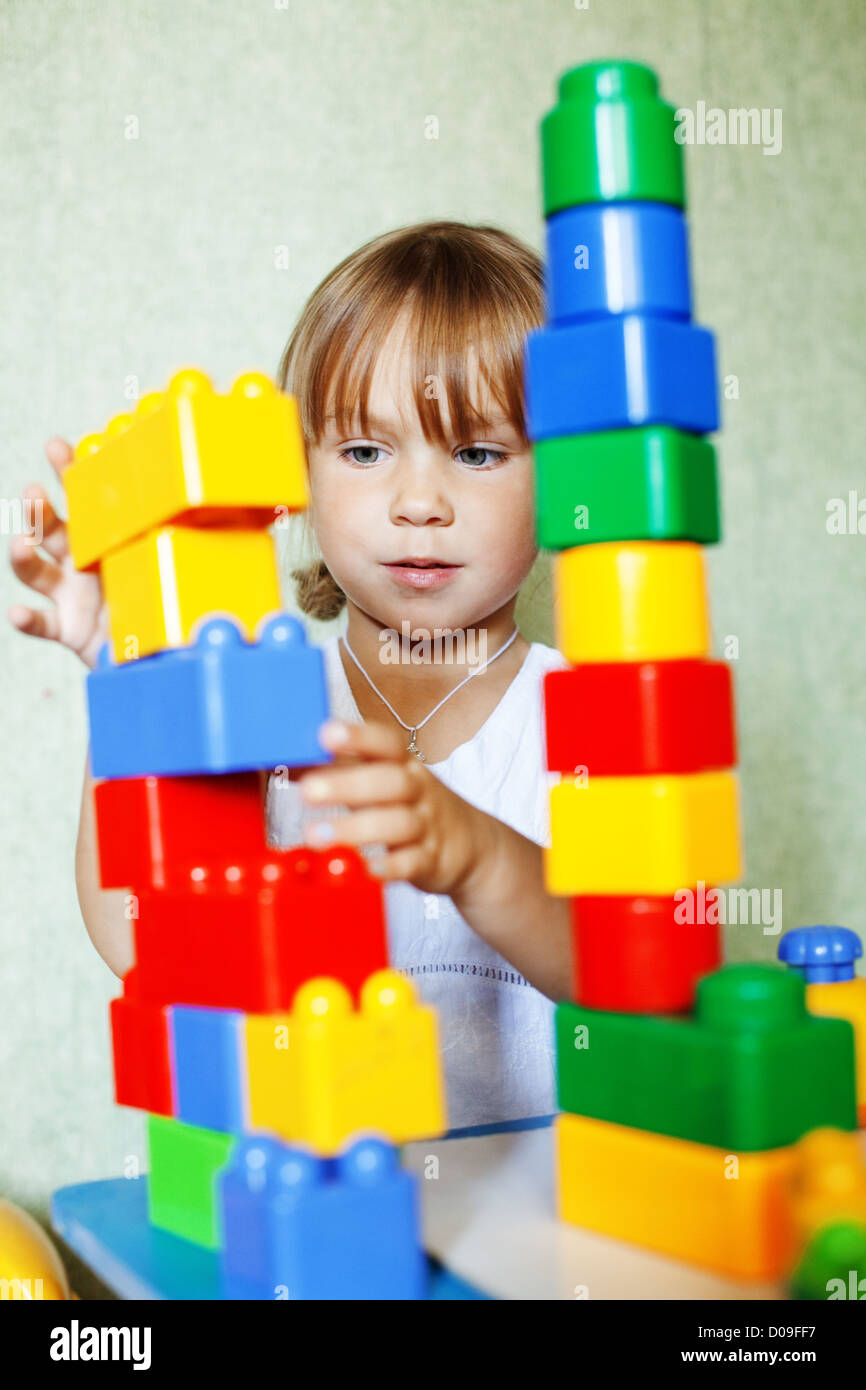 Cute child playing with the constructor bricks at home Stock Photo - Alamy