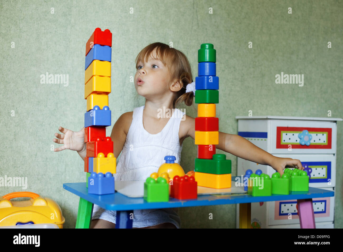 Cute child playing with the constructor bricks at home Stock Photo - Alamy