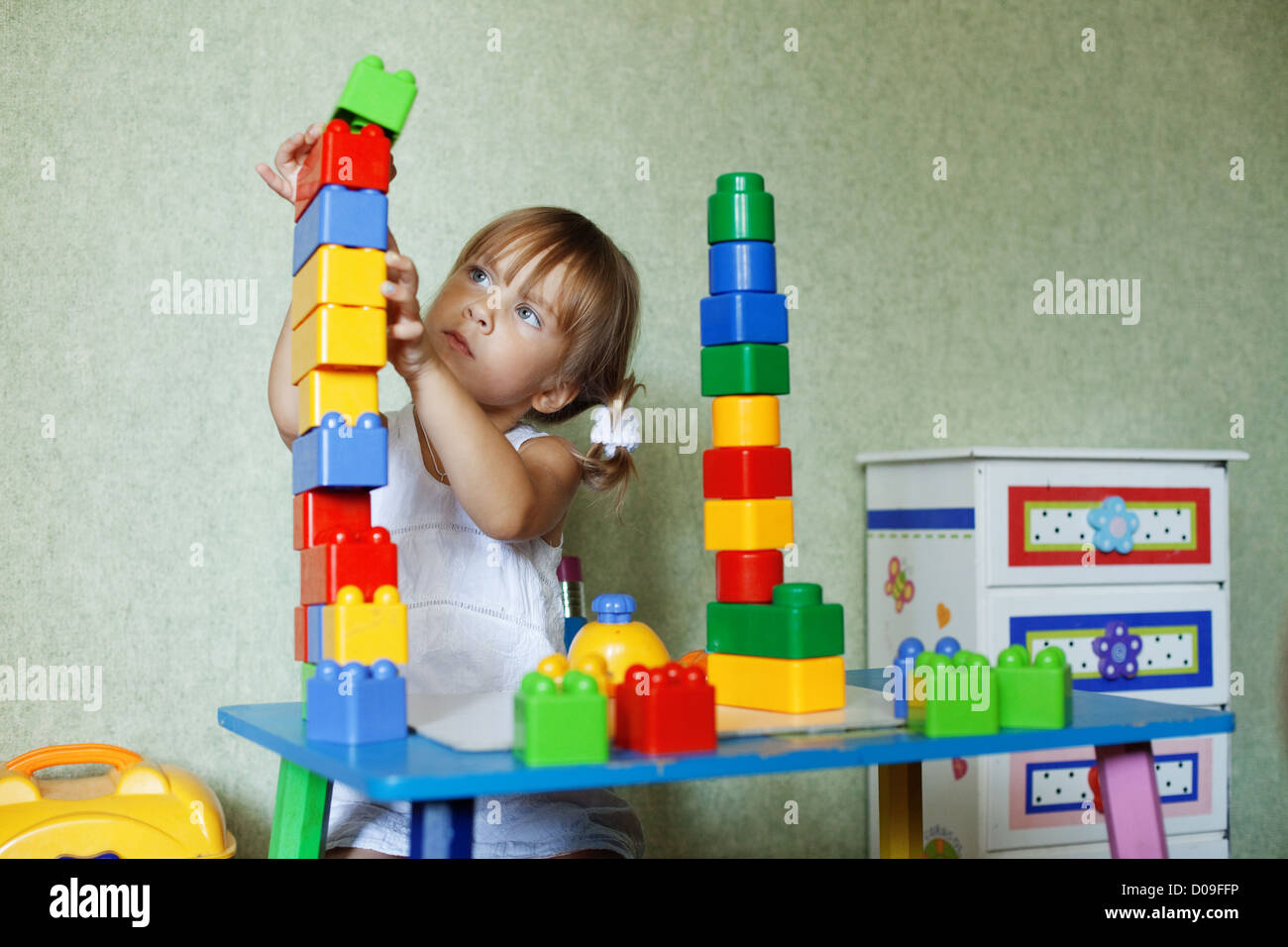 Cute child playing with the constructor bricks at home Stock Photo - Alamy
