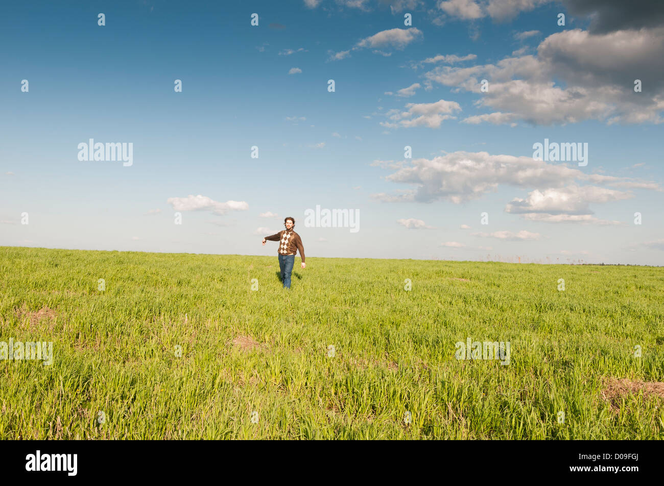 man one freedom green grass field infinite jumping happy Stock Photo ...