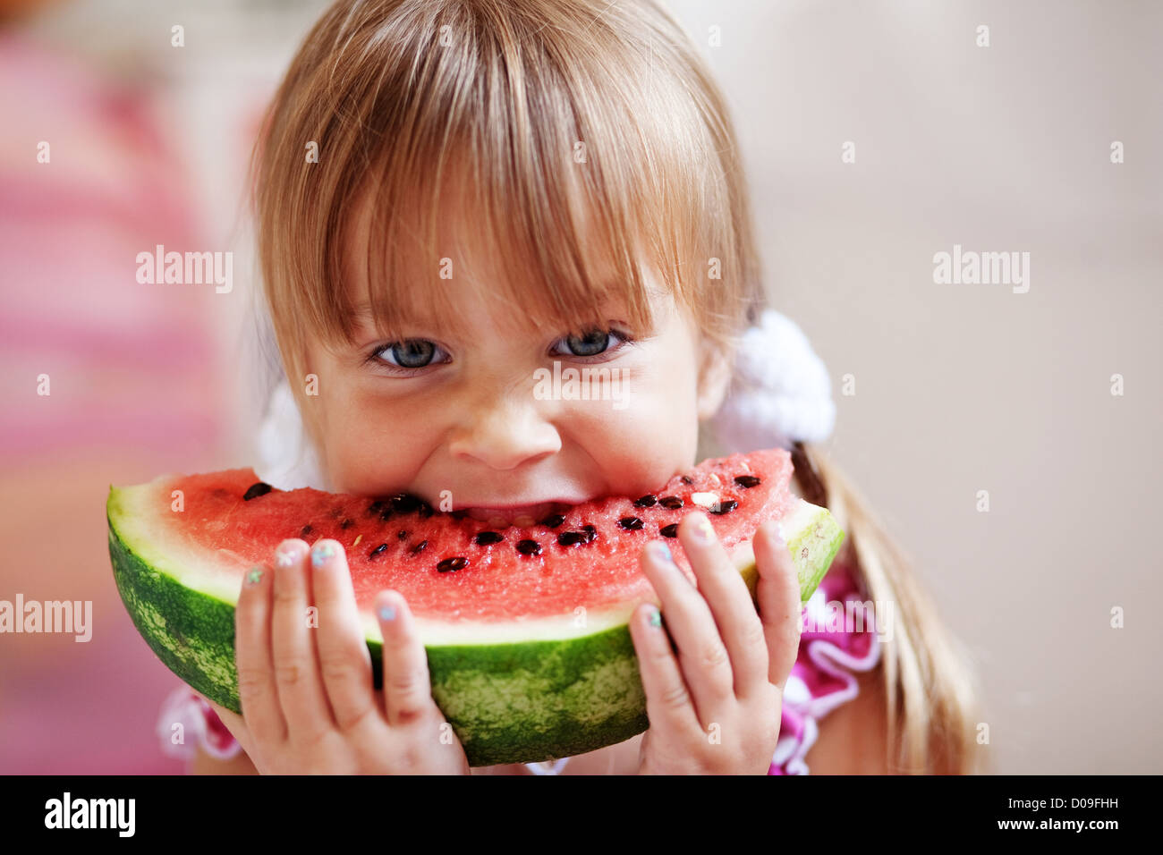 Funny child eating watermelon Stock Photo - Alamy