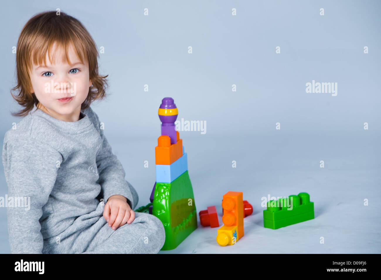 Child playing with bricks Stock Photo - Alamy