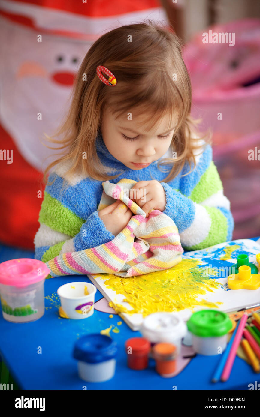 Little girl painting Stock Photo - Alamy