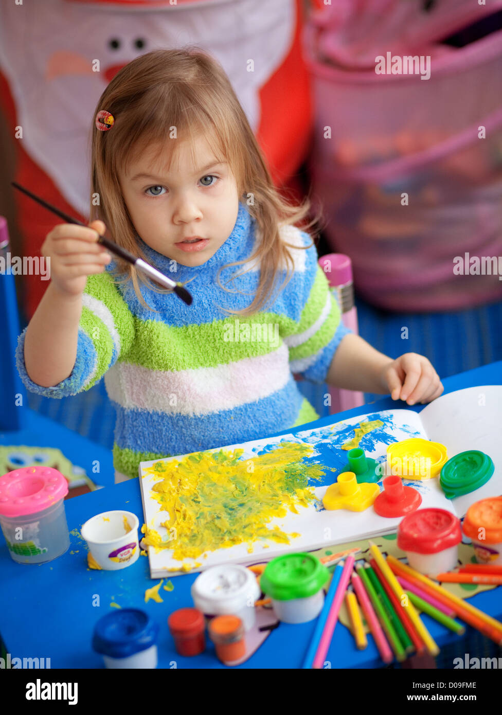 Little girl painting Stock Photo - Alamy