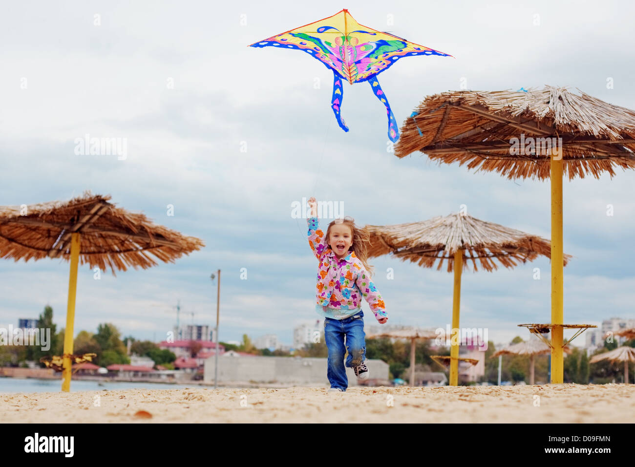 Child flying a kite Stock Photo - Alamy