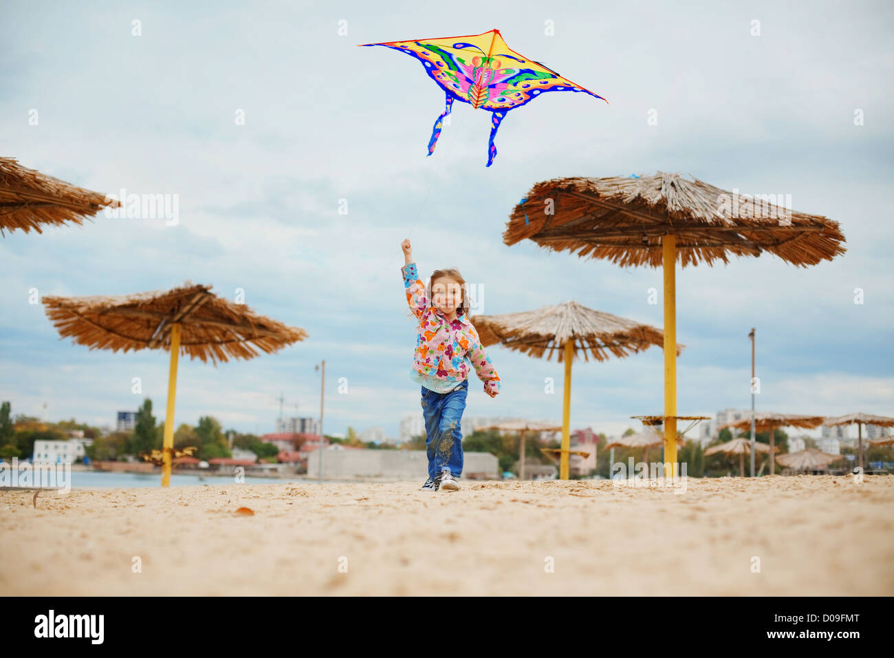 Child flying a kite Stock Photo - Alamy