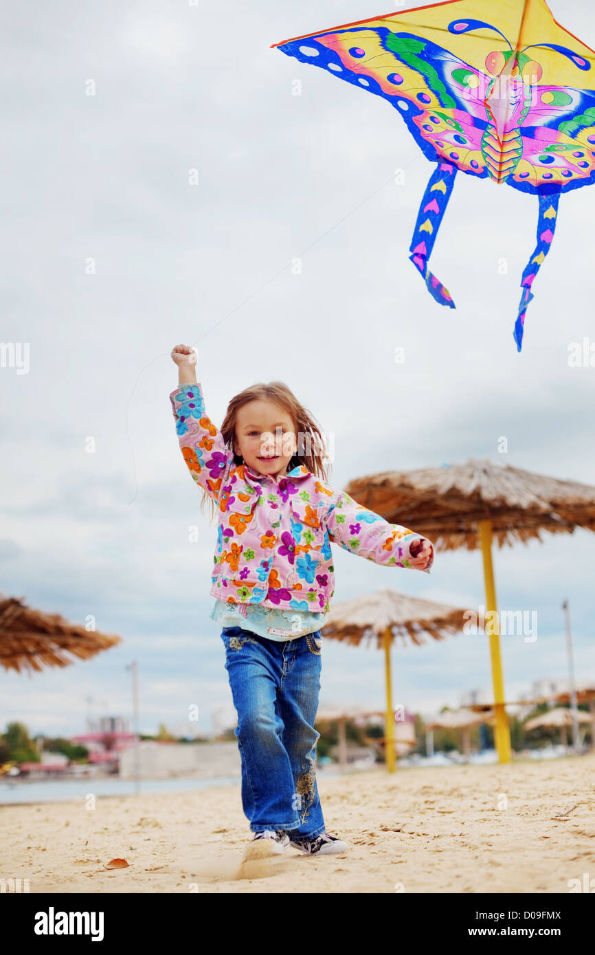 Child flying a kite Stock Photo - Alamy