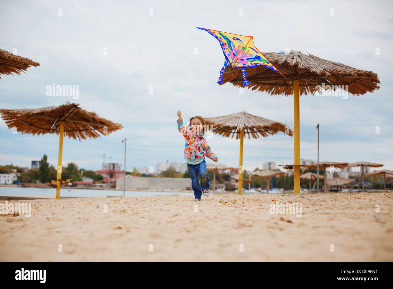 Child flying a kite Stock Photo - Alamy