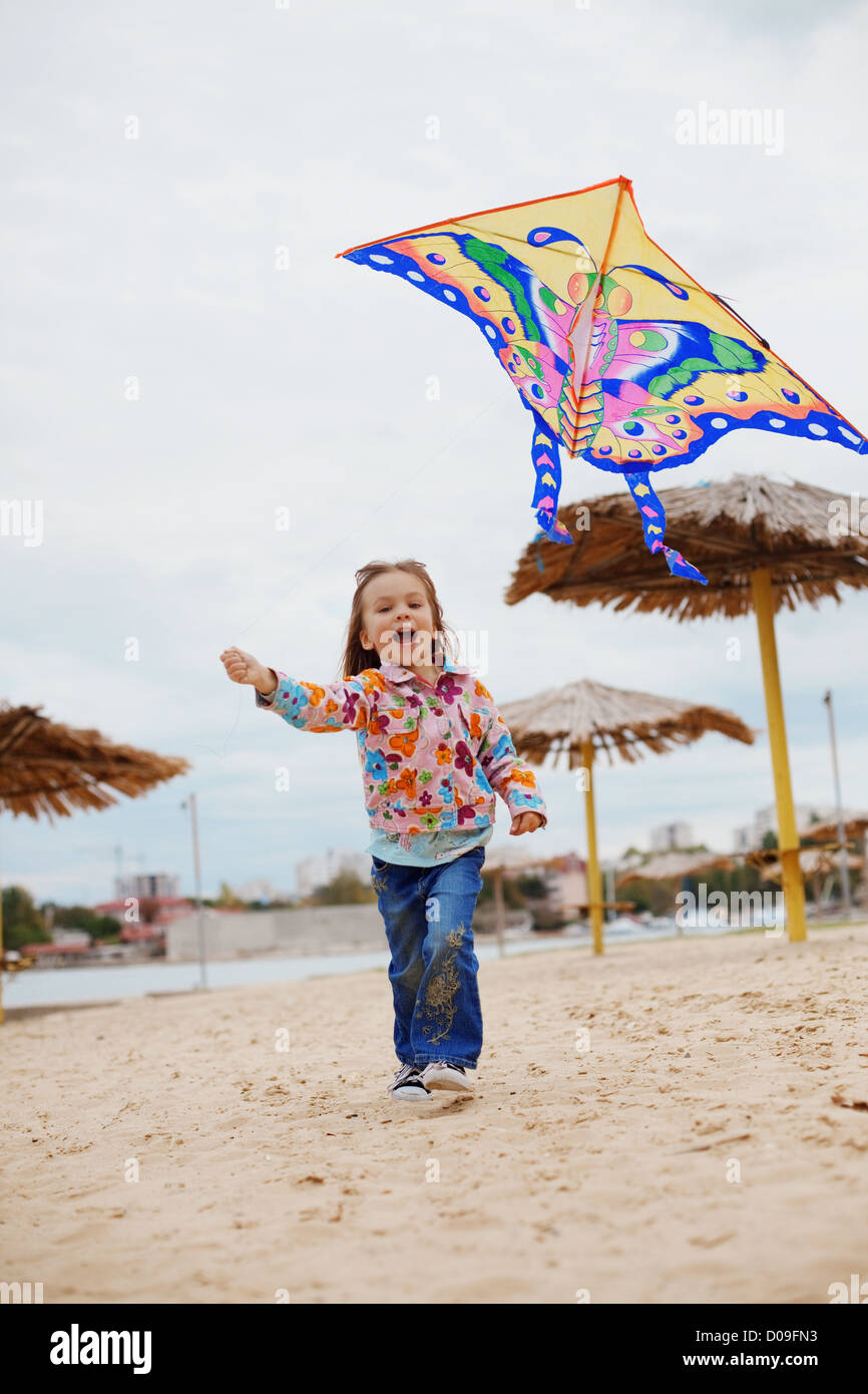 Child flying a kite Stock Photo - Alamy