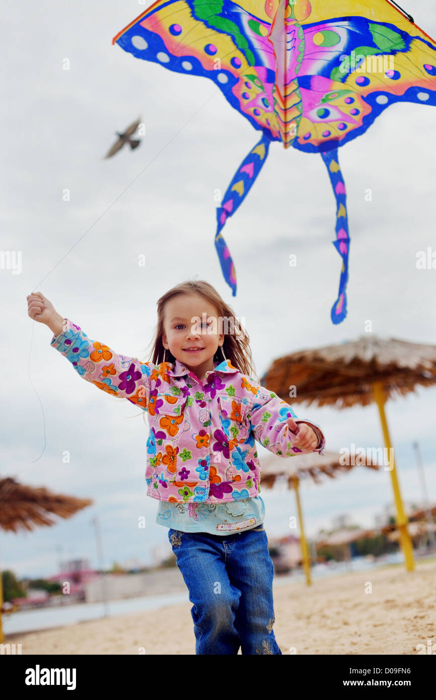 Cute child flying a kite outdoors Stock Photo - Alamy