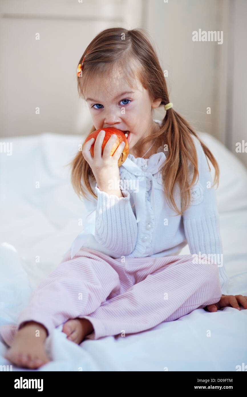 Child with apple Stock Photo - Alamy