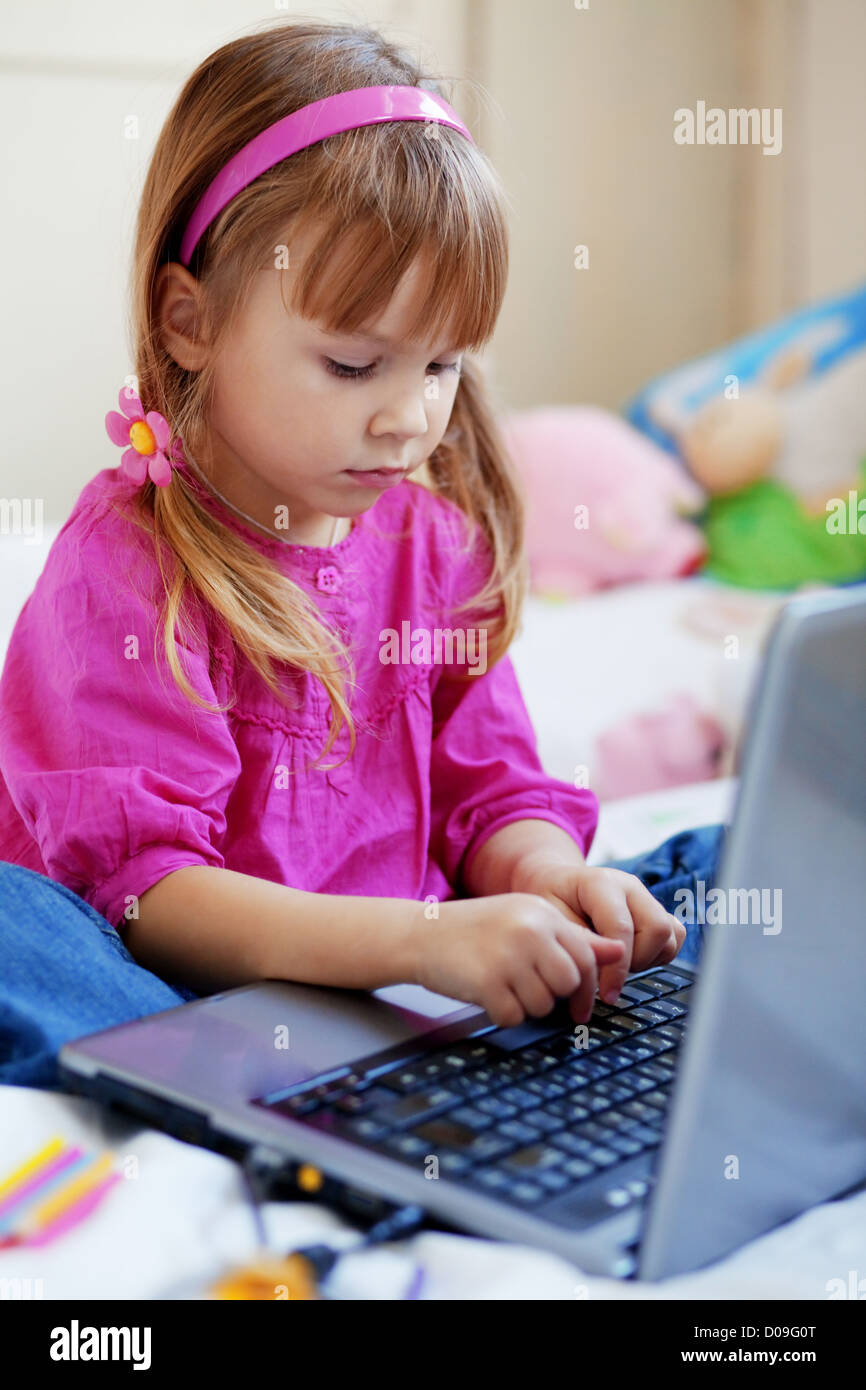 Little girl with laptop Stock Photo - Alamy