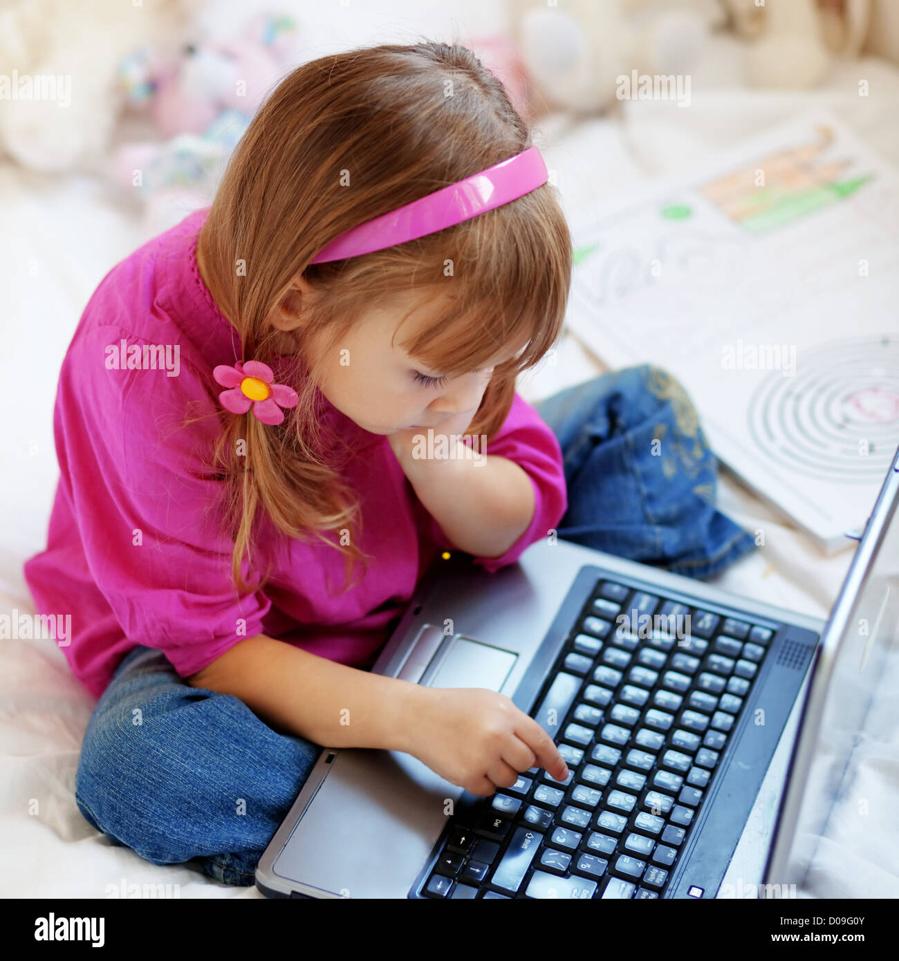Little girl with laptop Stock Photo - Alamy