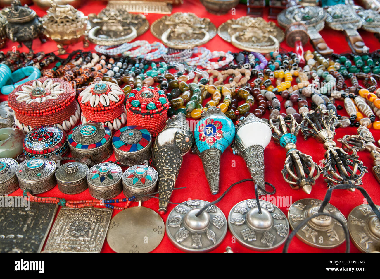 Conch shell horns, beads and religious objects at souvenir stall ...