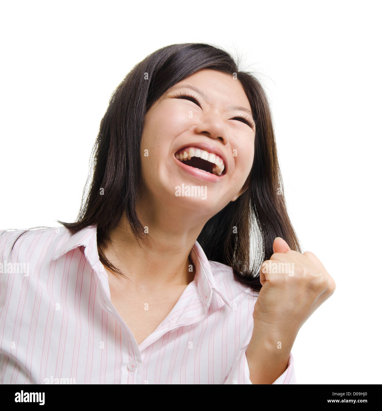 Portrait of excited business woman celebrating success over white ...