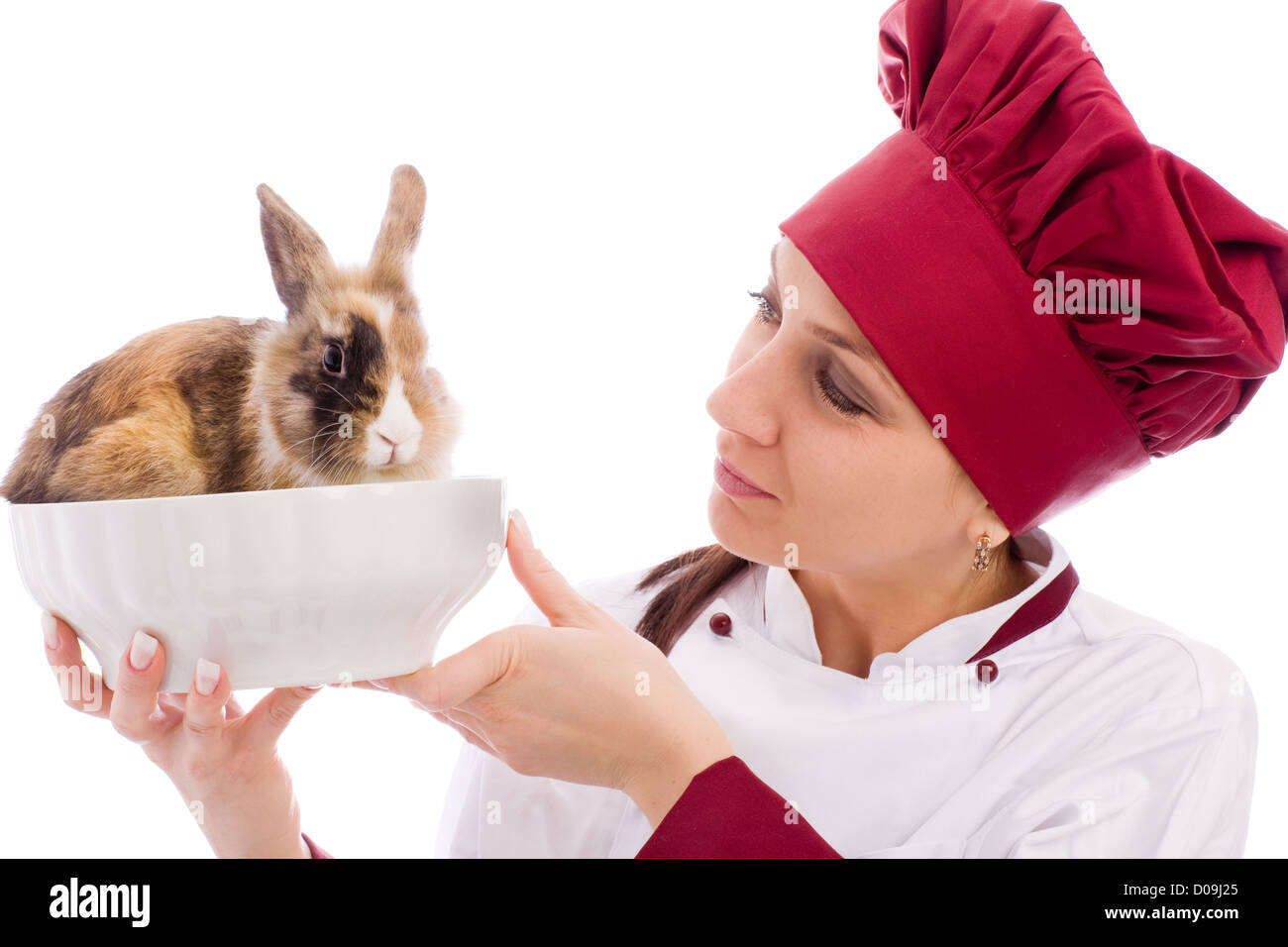 photo of succesfull female restaurant chef with rabbit inside a bowl ...