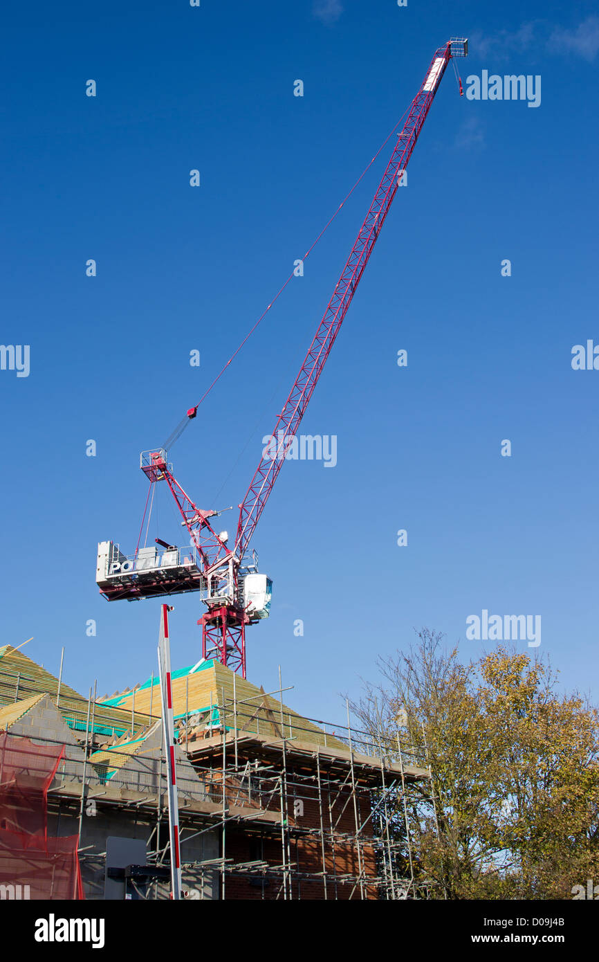 Construction site tower crane Stock Photo - Alamy
