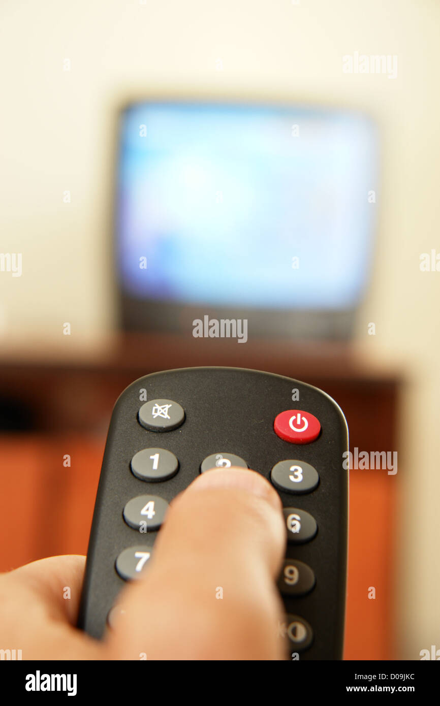 Television screen with tv remote control in foreground Stock Photo - Alamy