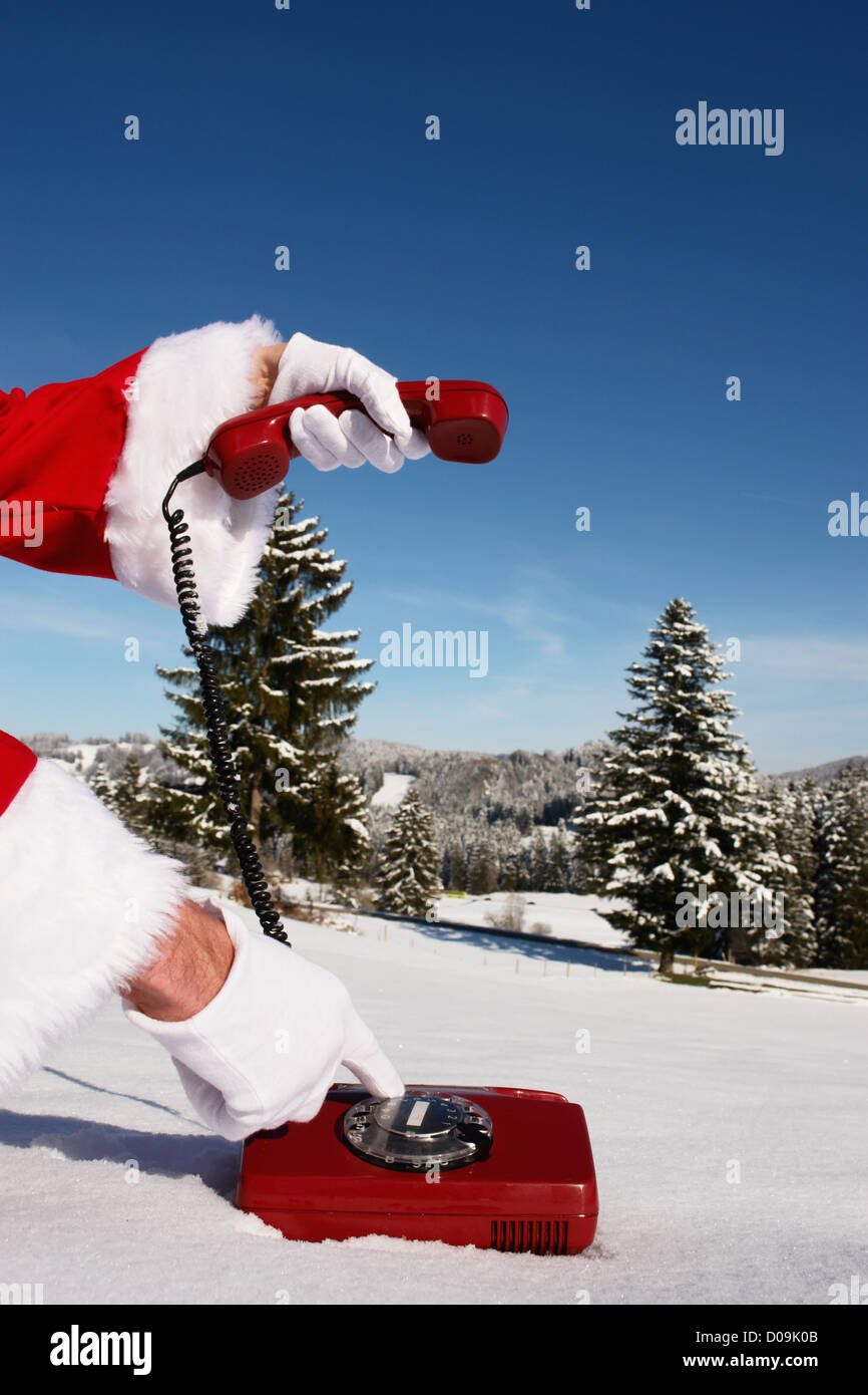 Santa Claus Hotline symbolized by a red retro phone Stock Photo - Alamy