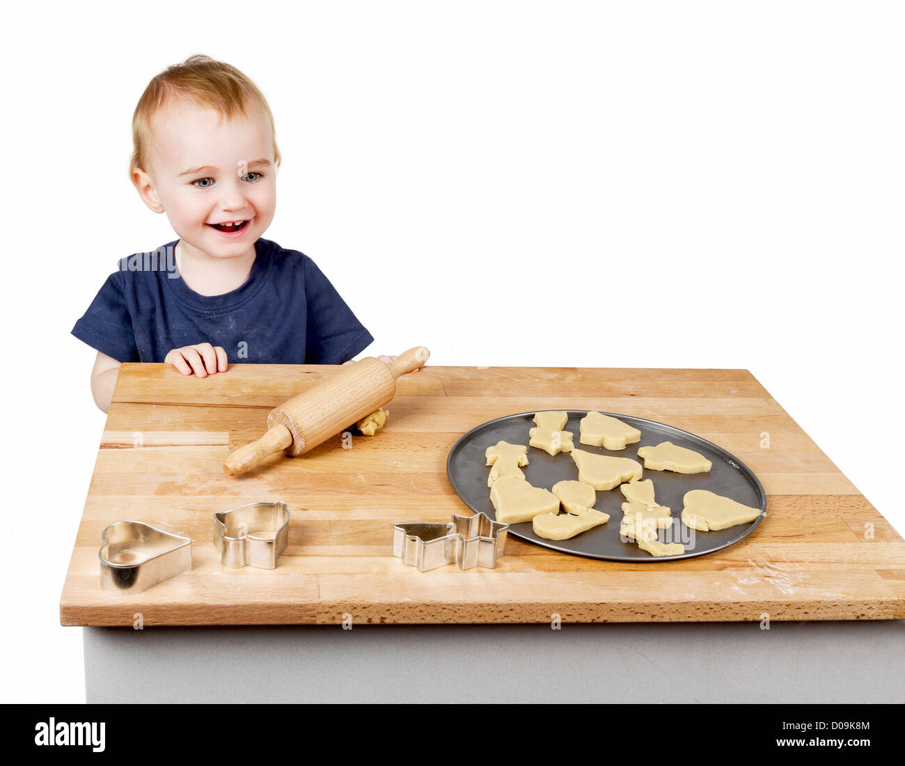 young child making cookies on small wooden desk Stock Photo - Alamy