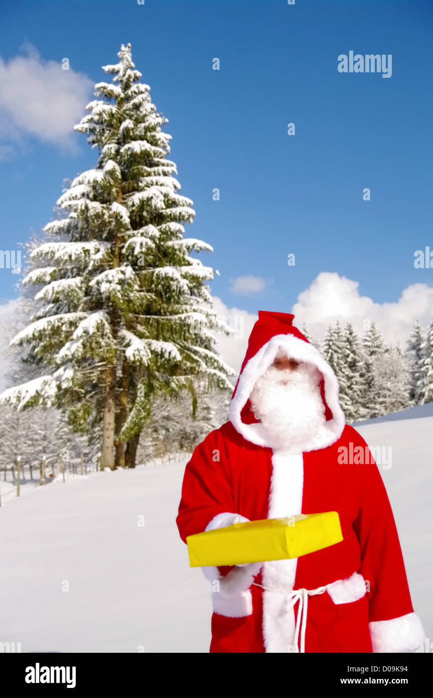 Santa claus delivers christmas gift hi-res stock photography and images ...